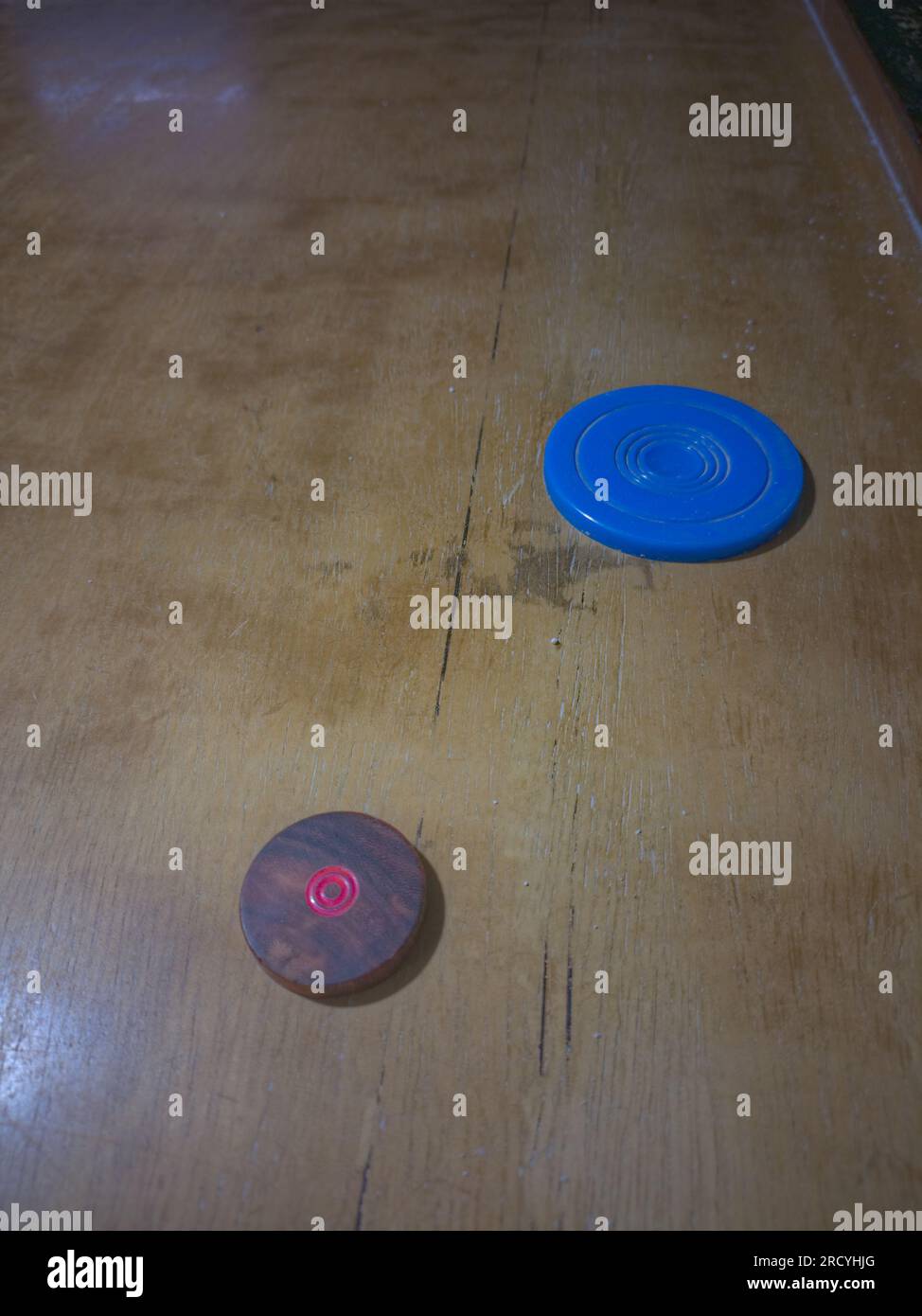 wooden carrom pieces lying on polished board with striker Stock Photo ...