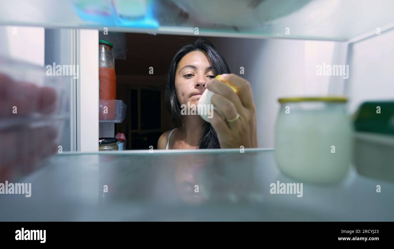 Woman taking food from refrigerator hi-res stock photography and images ...