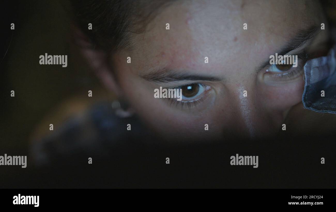 Woman staring at blue screen late at night extreme closup eyes Stock ...
