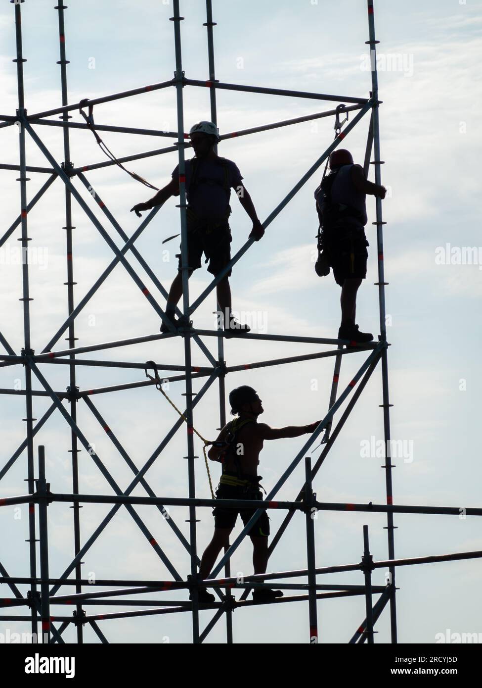 workers building a stage with scaffolding Stock Photo - Alamy