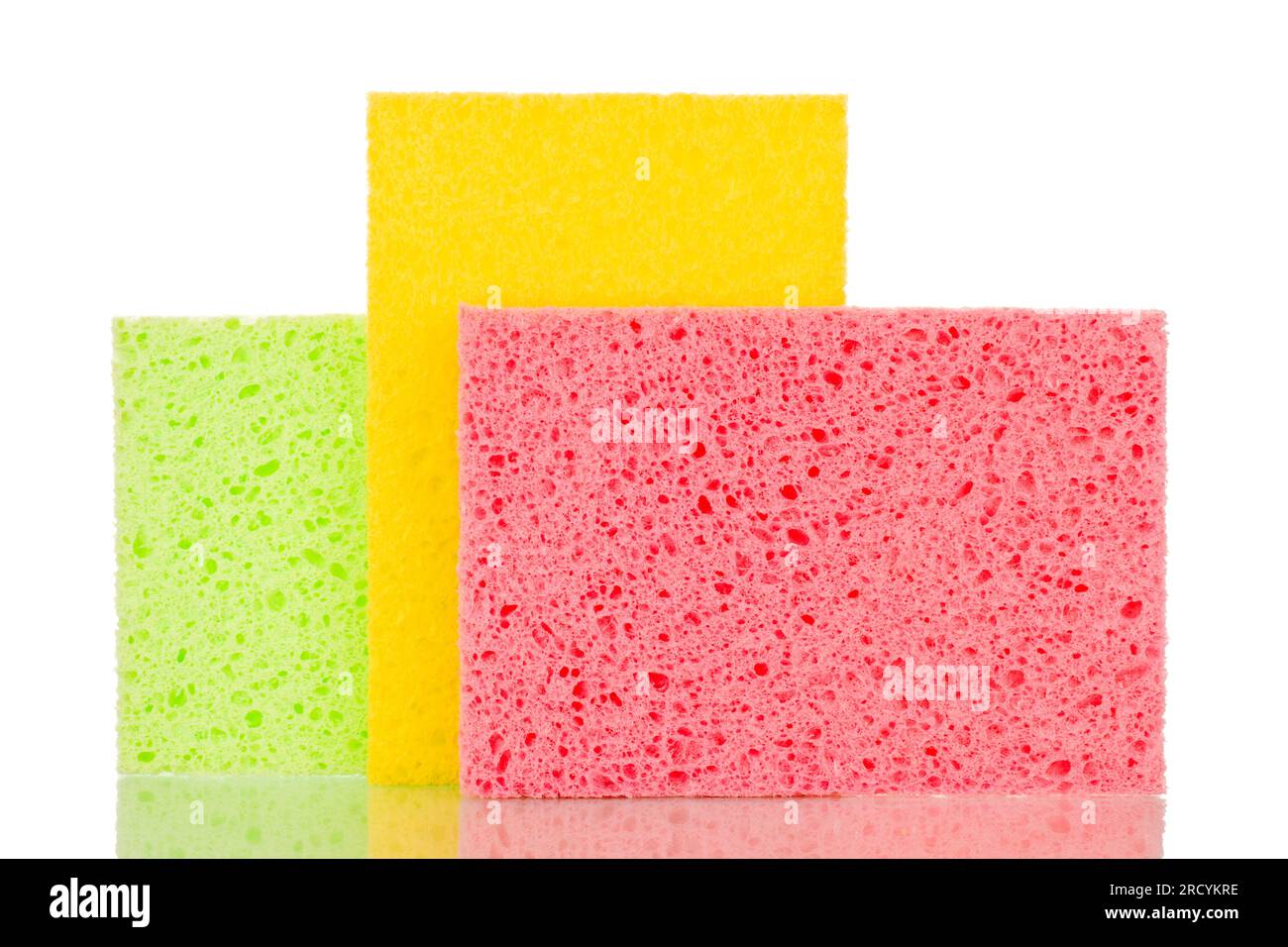 Three colored cellulose kitchen sponges, macro, isolated on white ...