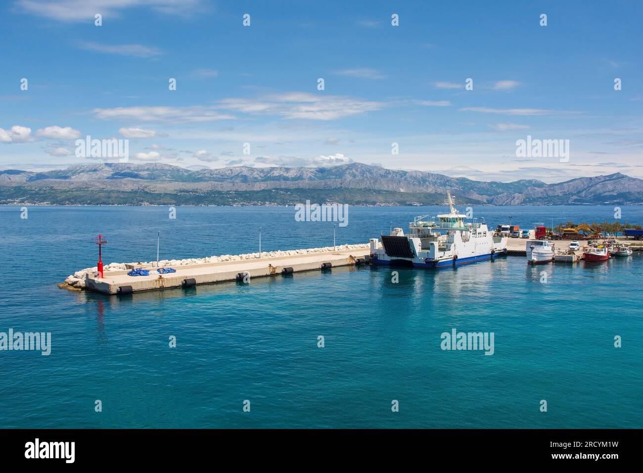 A roll-on-roll-off ferry at a pier in Supetar harbour on Brac Island in ...