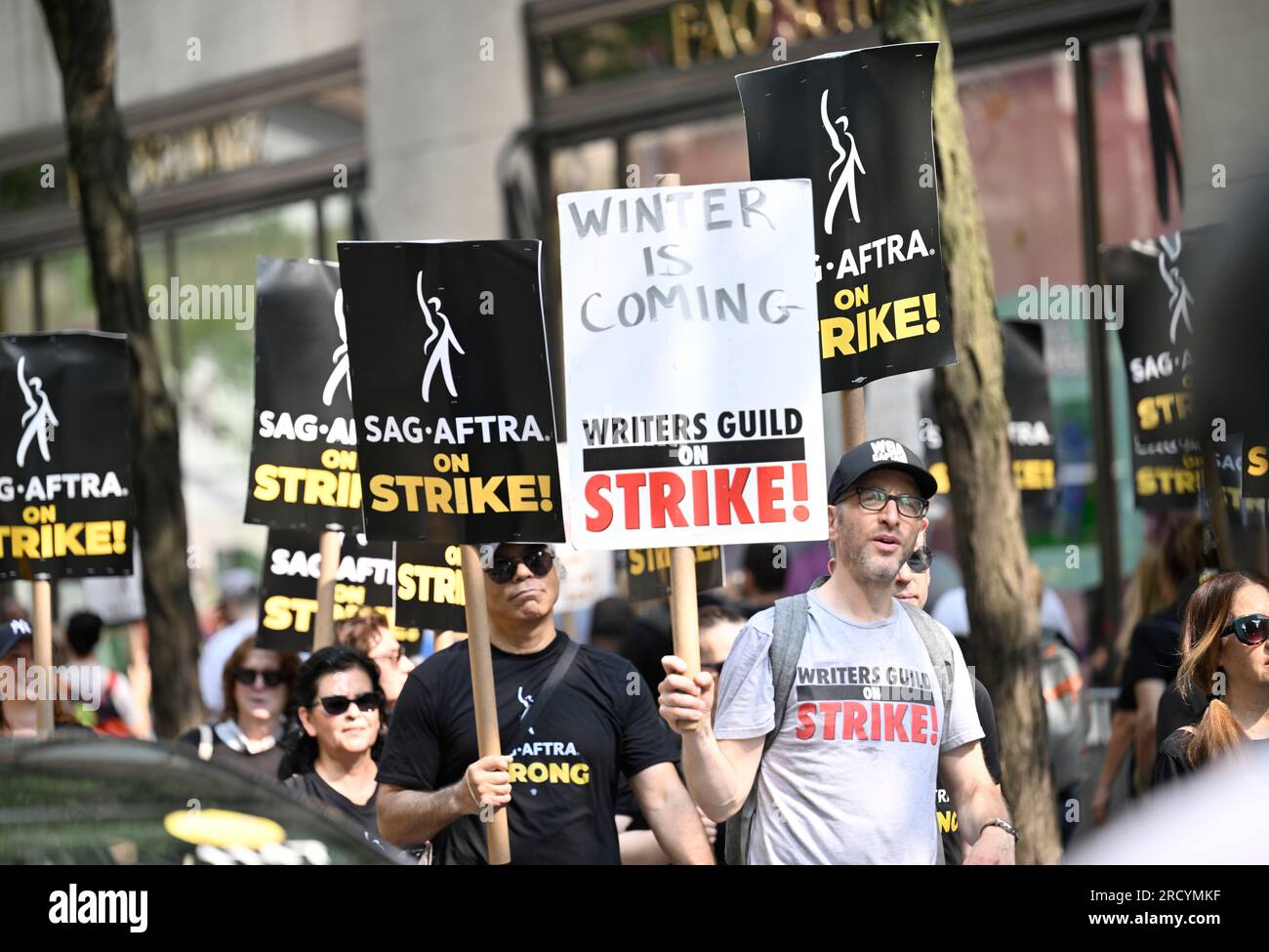 Picketers carry signs outside NBC in Rockefeller Center on Monday, July ...