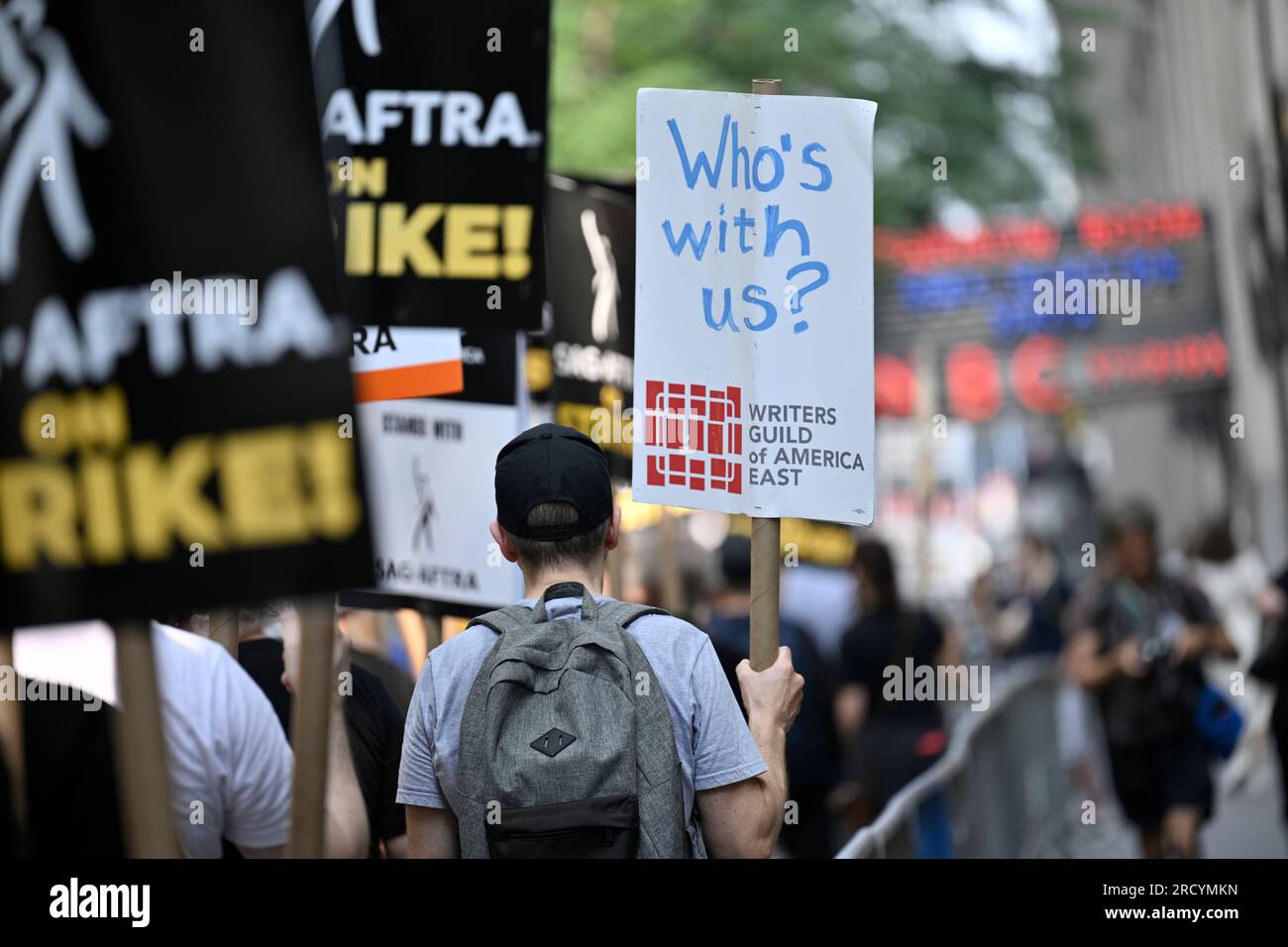 Picketers carry signs outside NBC in Rockefeller Center on Monday, July ...
