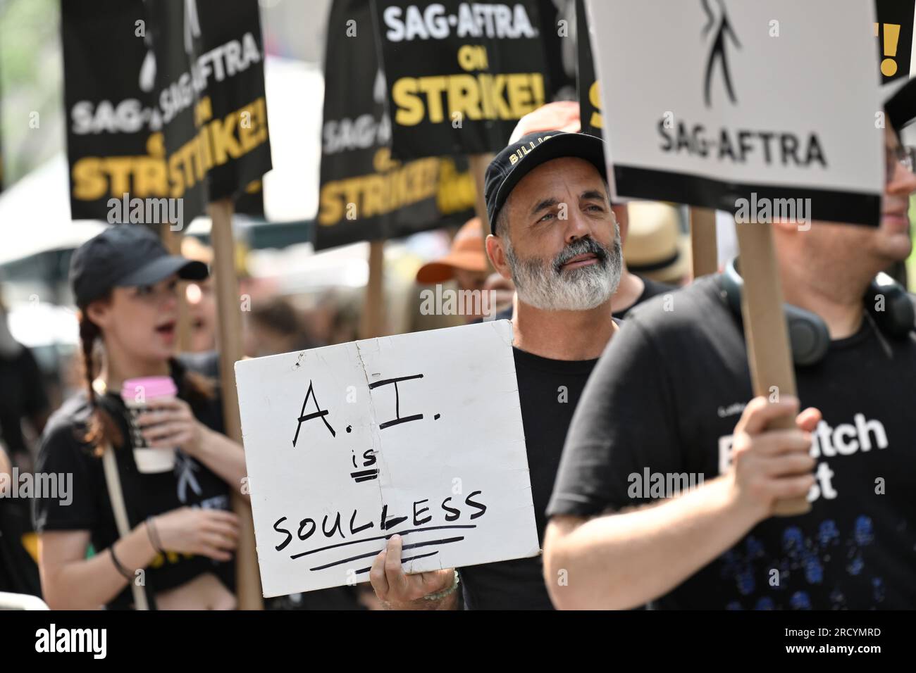 Picketers carry signs outside NBC in Rockefeller Center on Monday, July ...