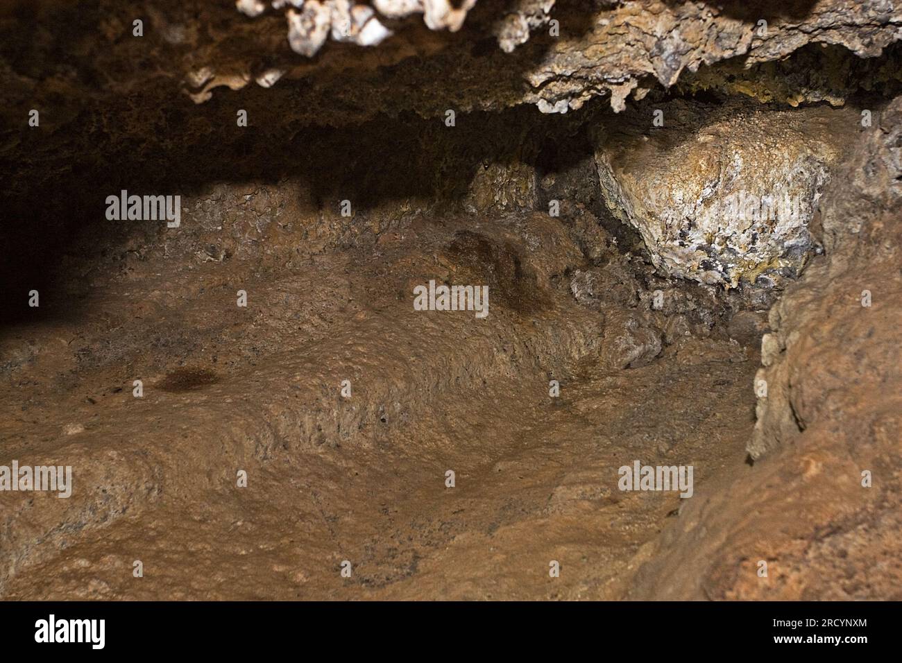 underground lava cave, illuminated by a rock painting of local ...