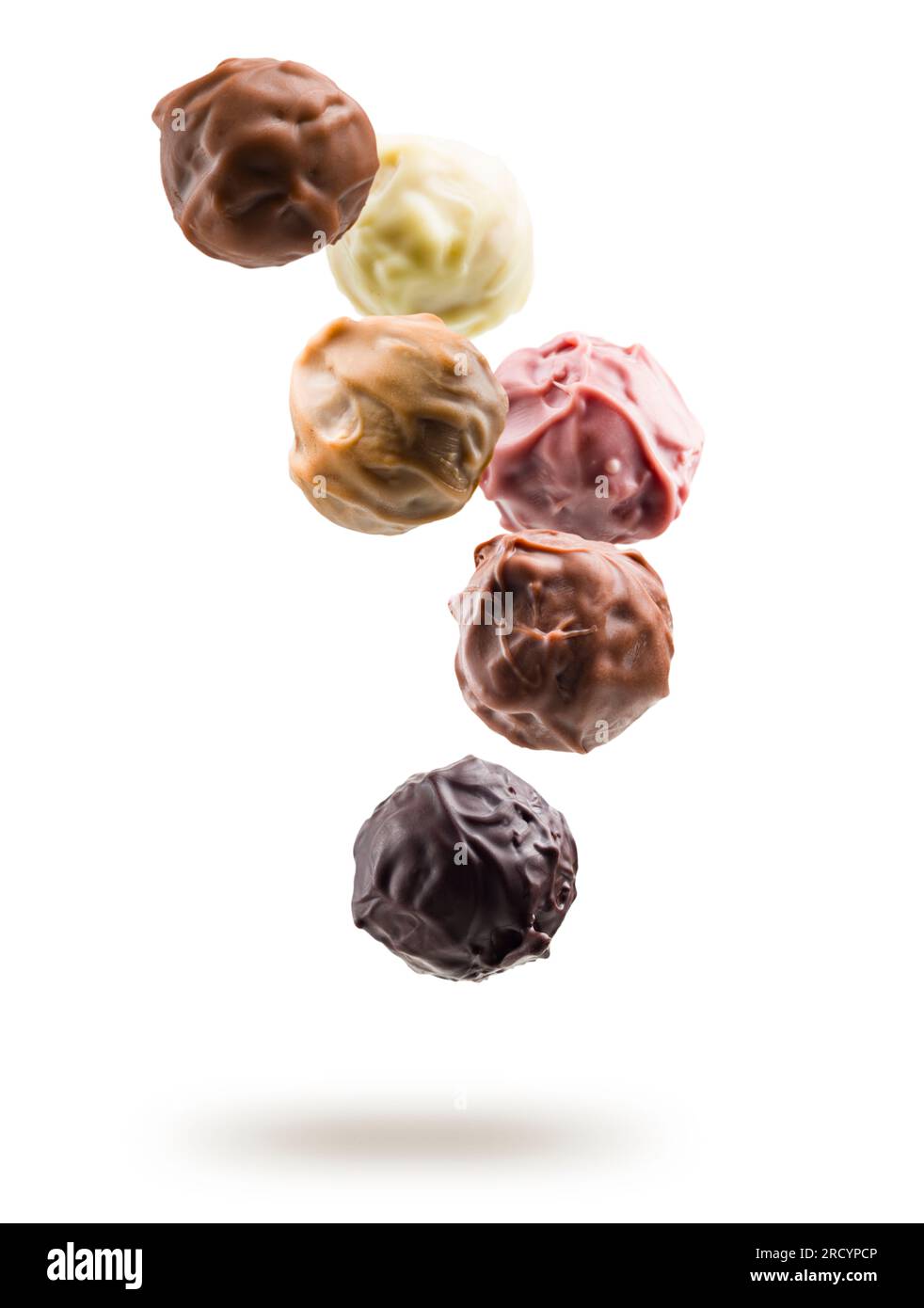 Assorted chocolate pralines floating on white background Stock Photo ...