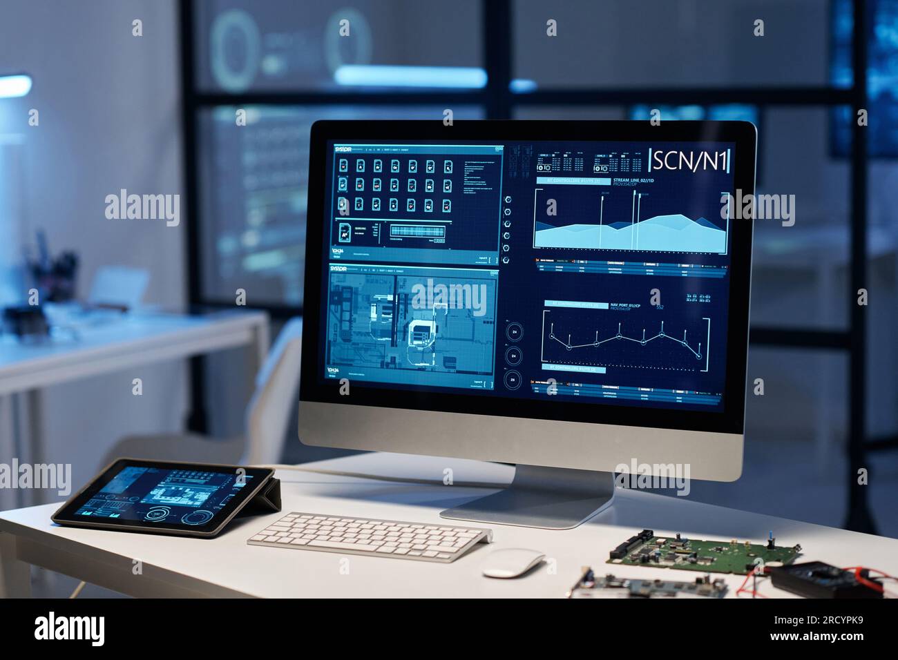 Horizontal image of computer with software on monitor standing on ...