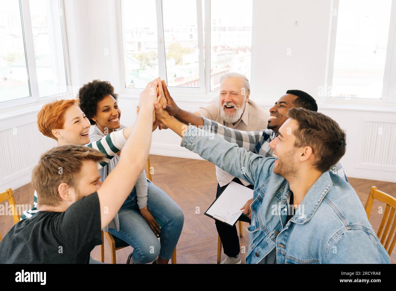 High-angle view of happy overjoyed multicultural and different ages ...