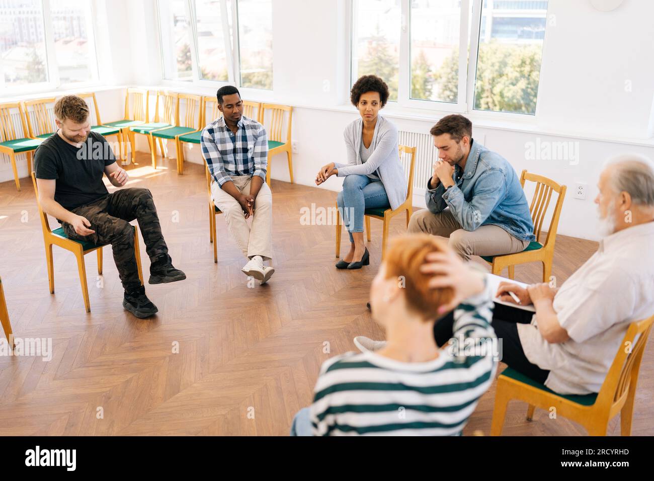 Wide shot of community, support and psychology with diverse and ...