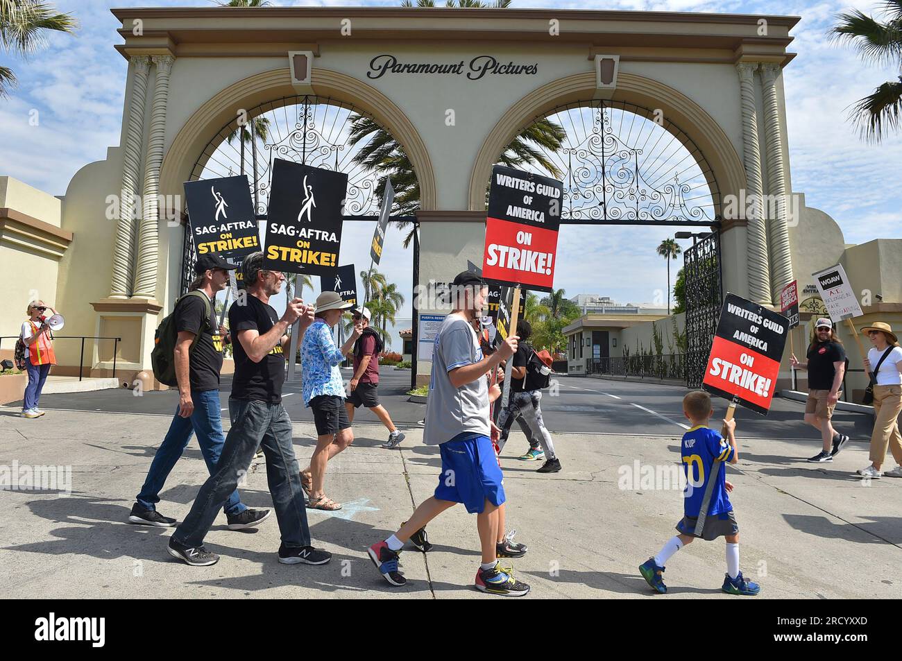 Picketers carry signs outside Paramount studios in Los Angeles on ...
