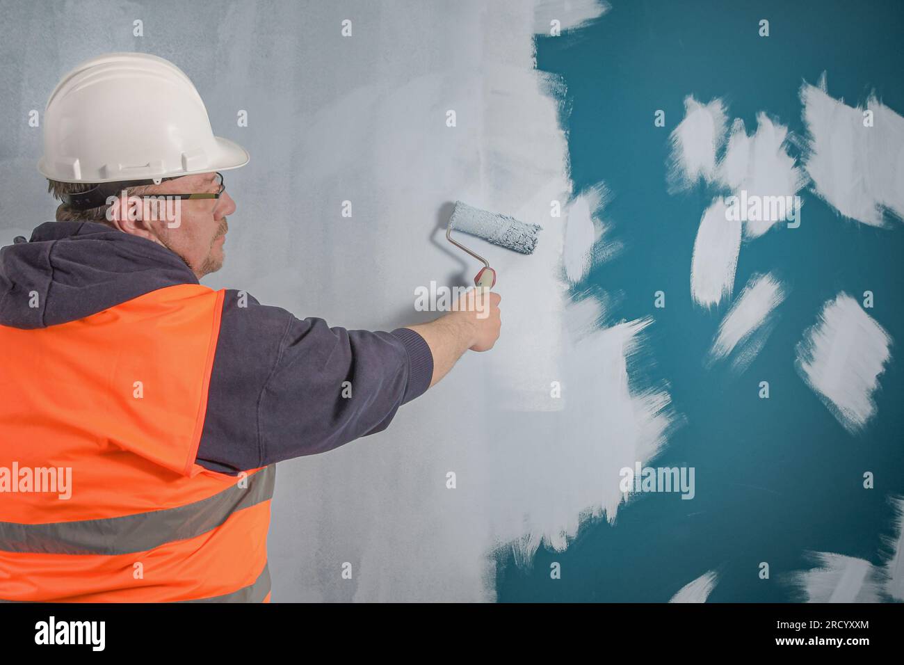 Pre-wiped damage on the wall with the first coat of paint applied ...