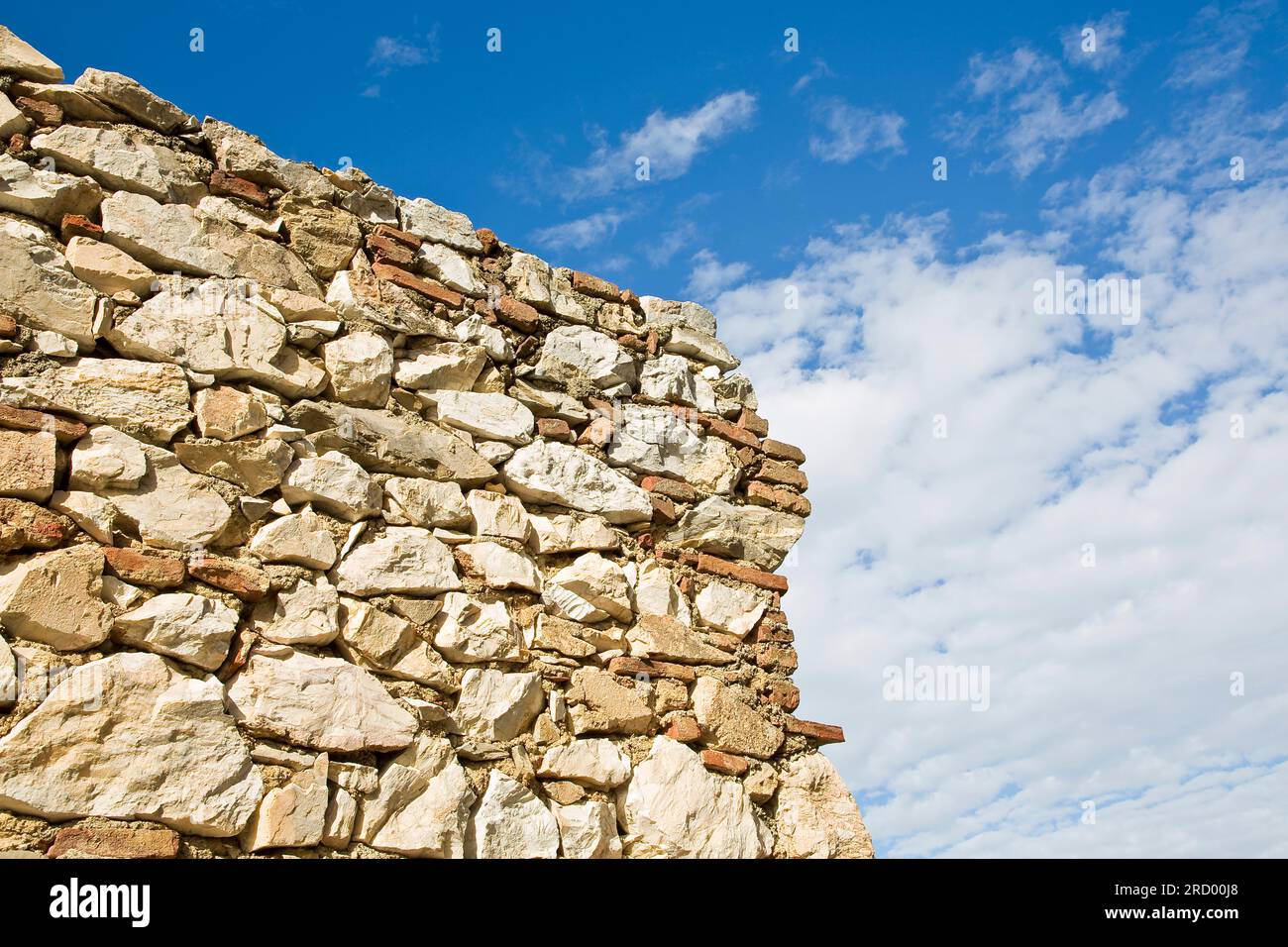 Stone wall with large stone blocks against a sky background Stock Photo ...