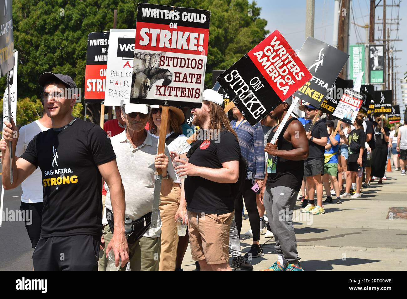 Picketers carry signs outside Paramount studios in Los Angeles on ...