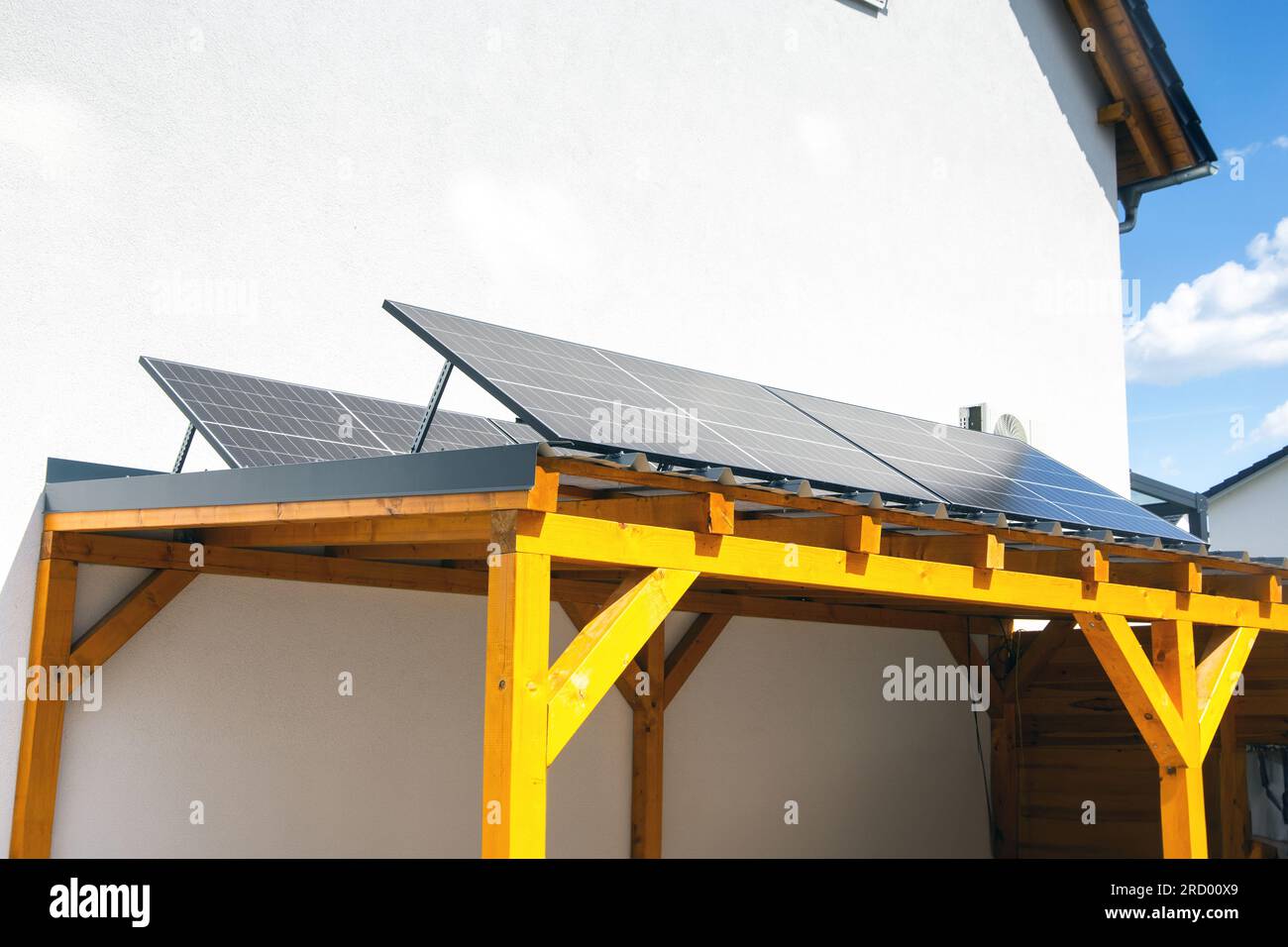 Wooden carport with solar system on a residential house Stock Photo - Alamy