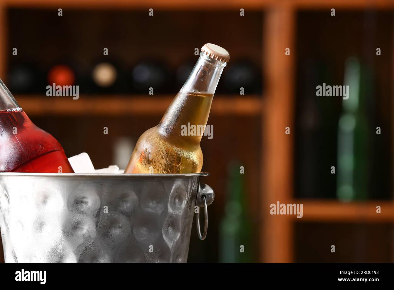 Bucket with bottles of cold beer in bar, closeup Stock Photo - Alamy