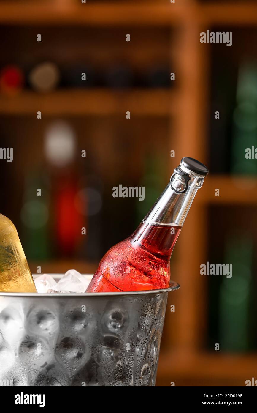 Bucket with bottles of cold beer in bar, closeup Stock Photo - Alamy