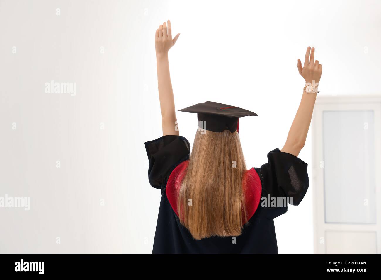 Female graduate student in hall, back view Stock Photo - Alamy
