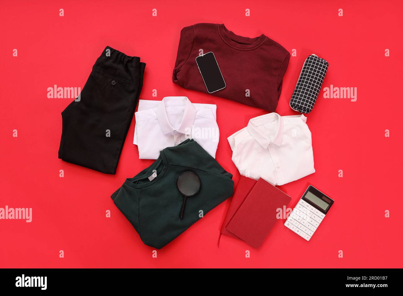 Composition with stylish school uniform, mobile phone and stationery on ...
