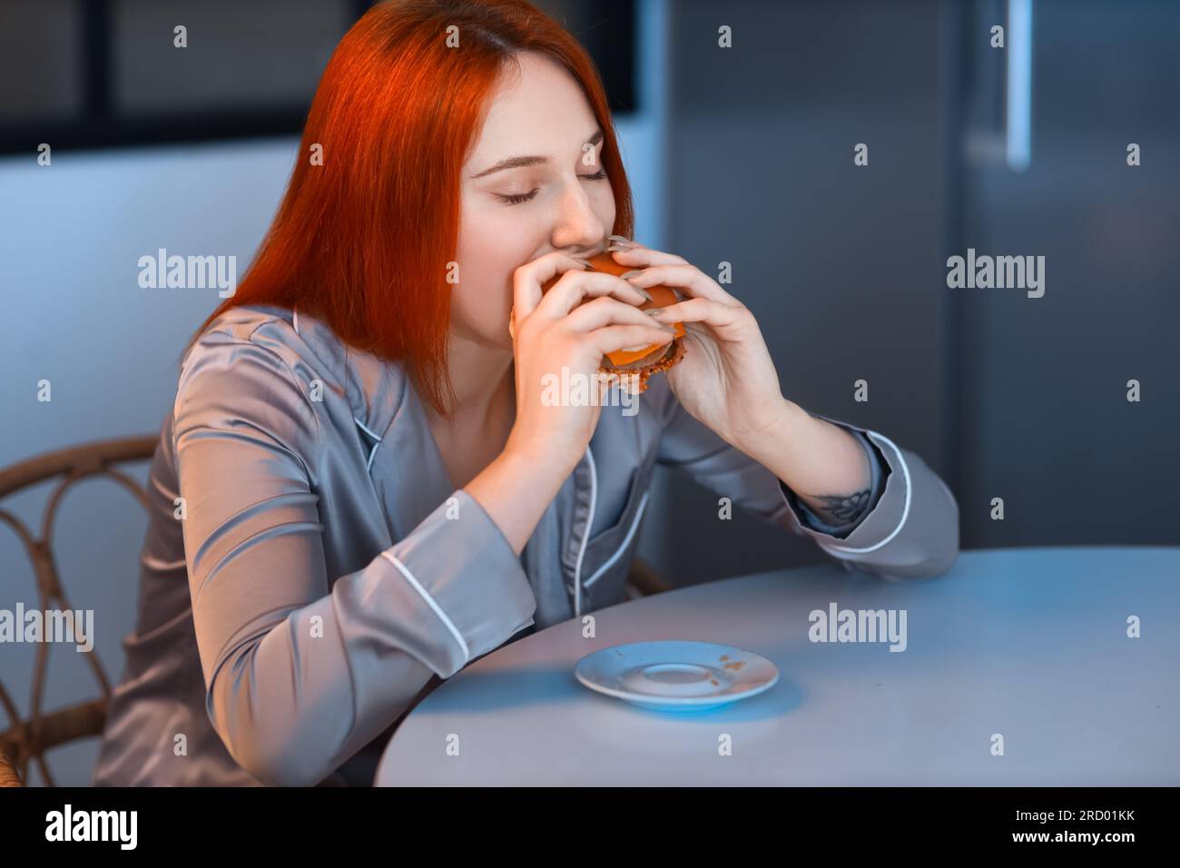 Woman eating burger night hi-res stock photography and images - Alamy