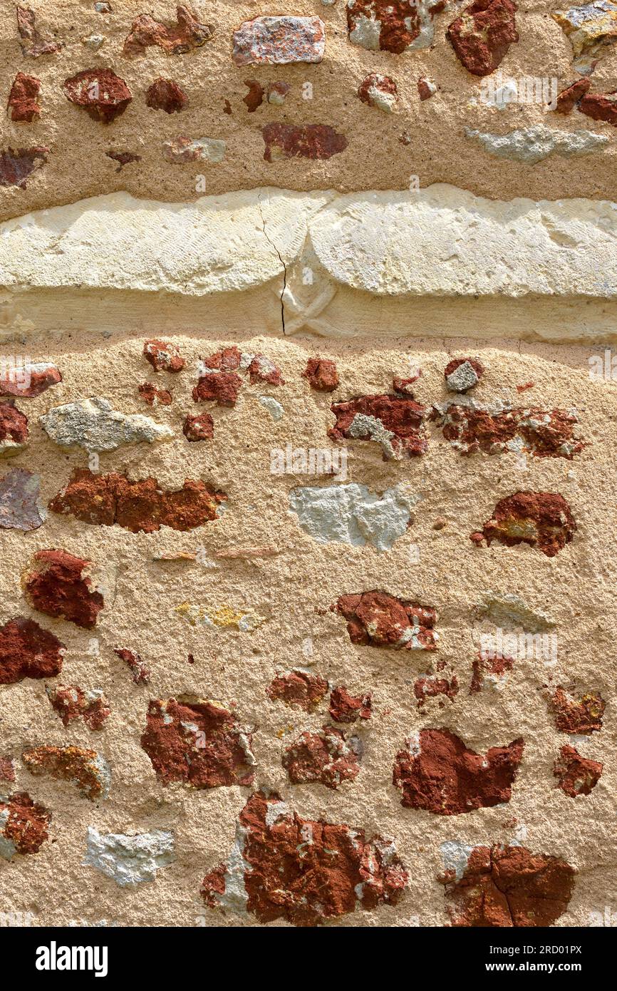 Detail of traditional red stone building materials in-filling old ...