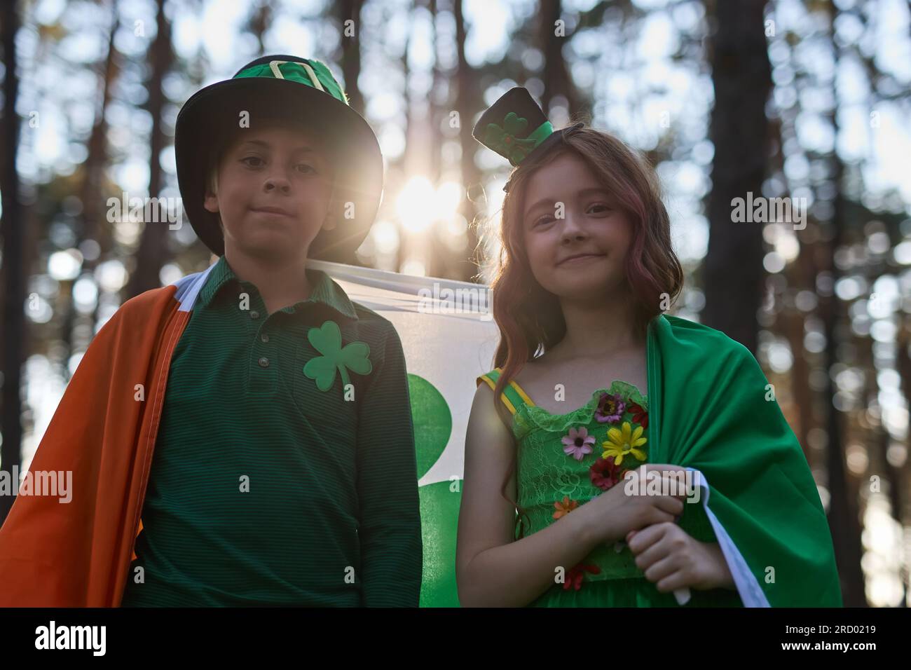 Kids celebrating St Patricks Day. Young boy and girl dressed in ...