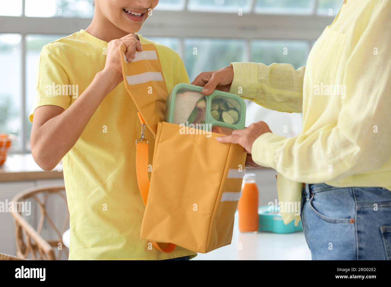 Mother boy packing backpack hi-res stock photography and images - Alamy