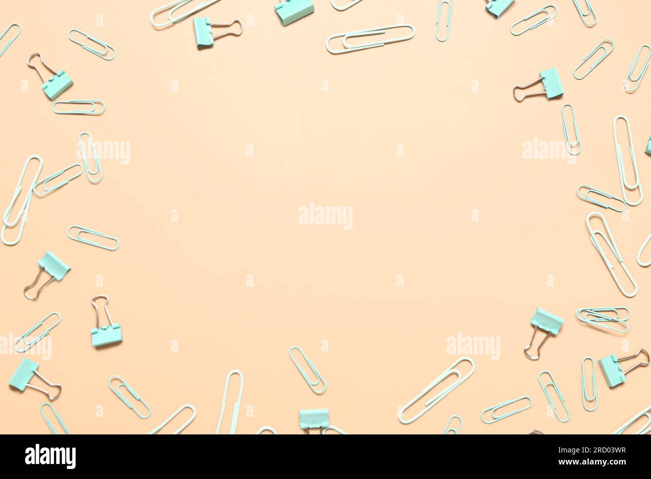 Frame made of colorful binder clips on beige background Stock Photo - Alamy