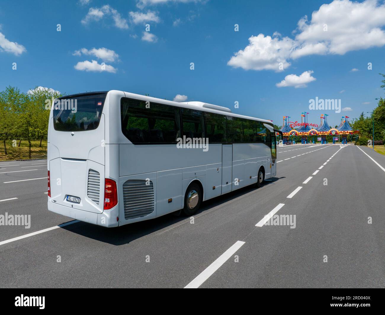 White Modern comfortable tourist bus driving through highway to ...
