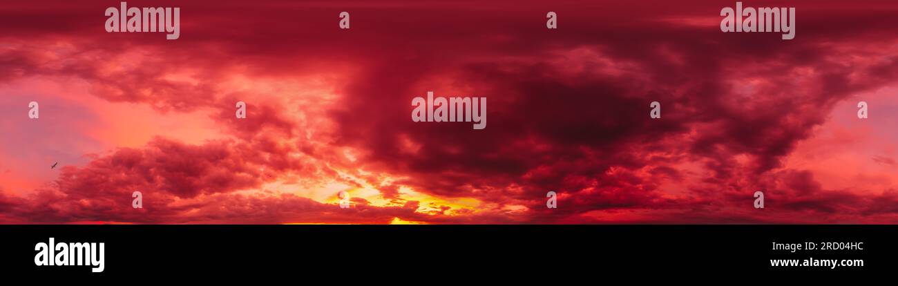 Dramatic sunset sky panorama with bright glowing red pink Cumulus ...