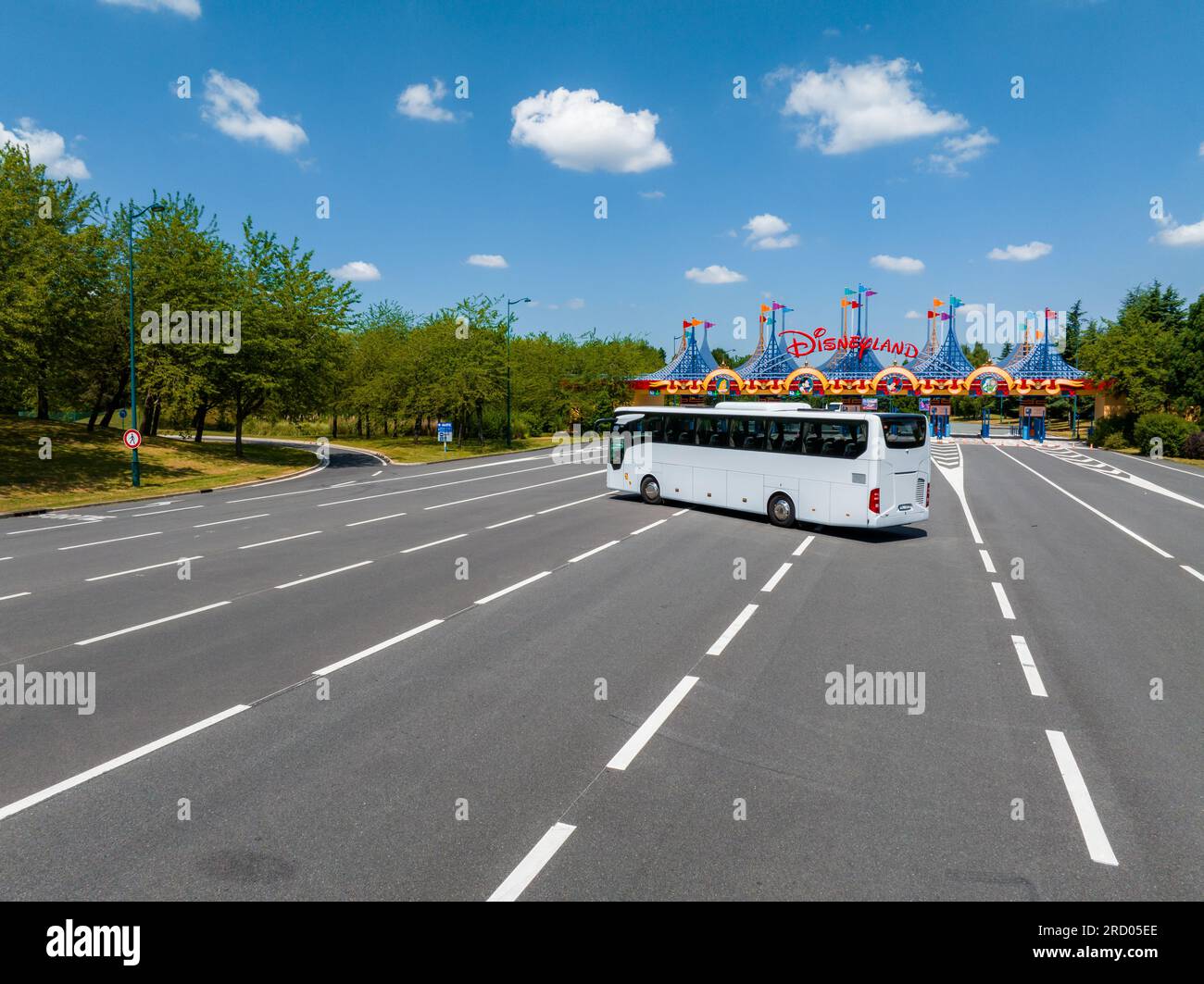 White Modern comfortable tourist bus driving through highway to ...