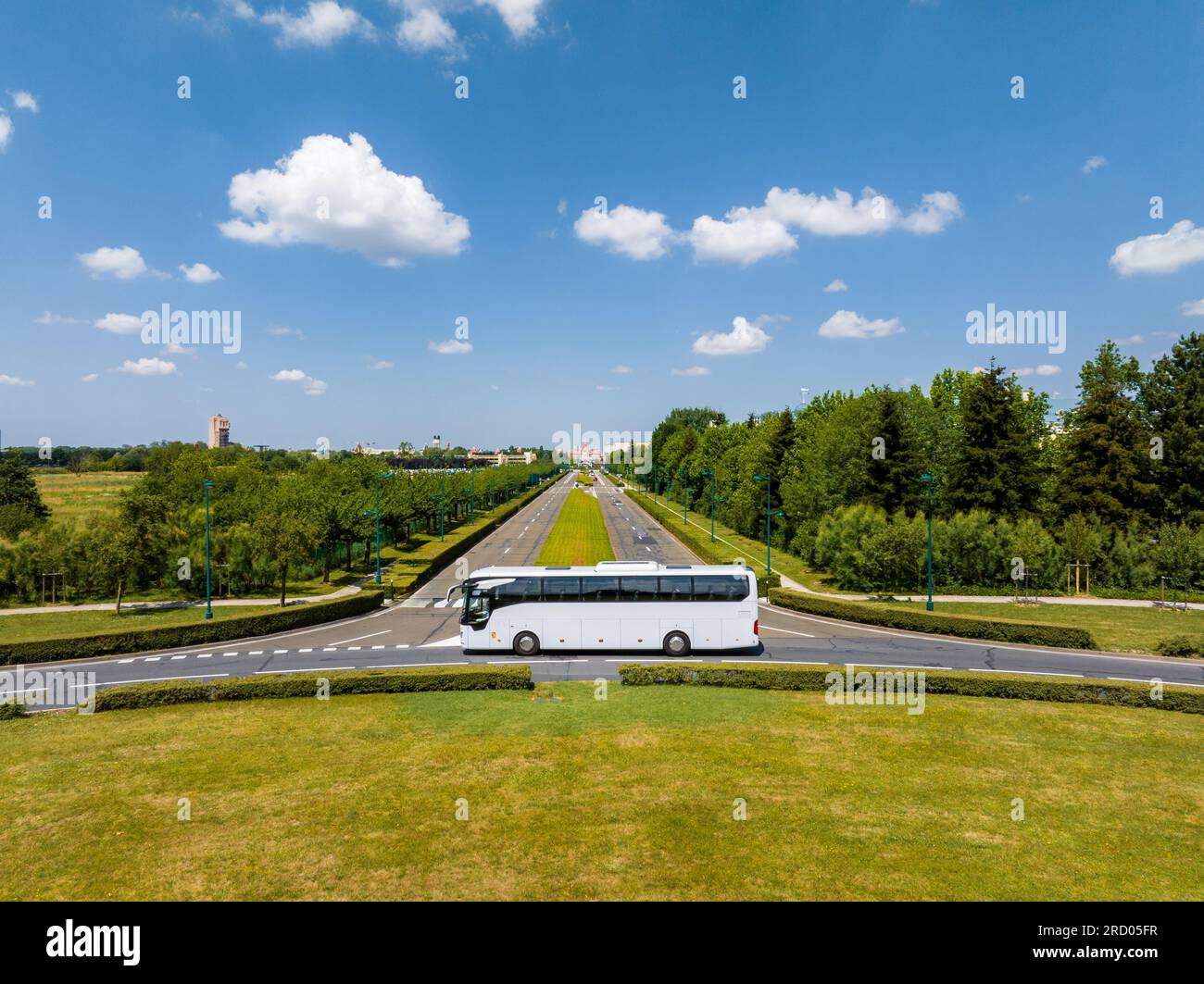 White Modern comfortable tourist bus driving through highway to ...