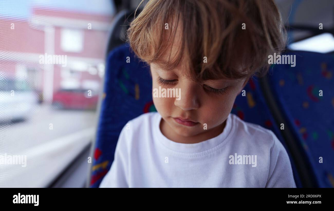 One pensive passenger child traveling by public transportation ...