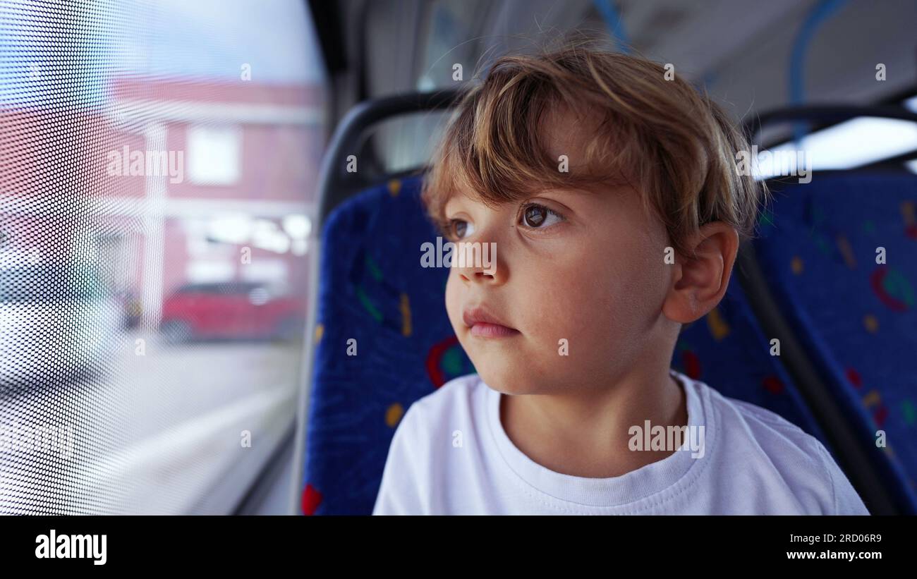 One pensive passenger child traveling by public transportation ...
