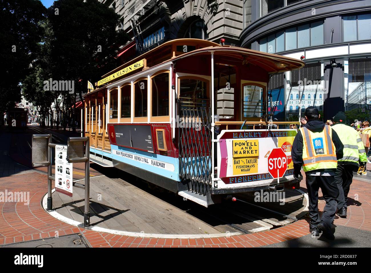 Drivers turning cable car on a turntable, San Francisco, California ...