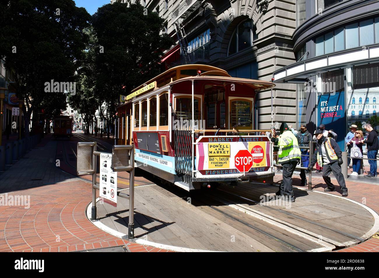 Drivers turning cable car on a turntable, San Francisco, California ...