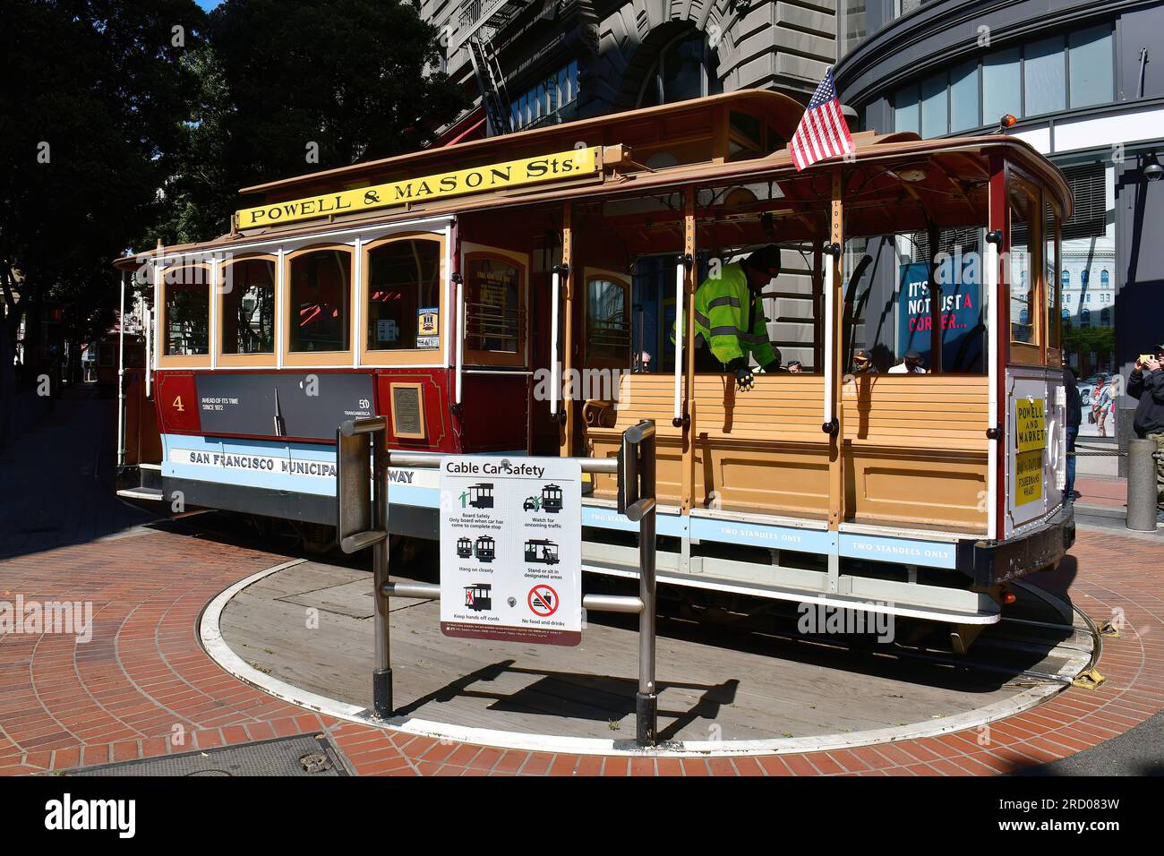 Drivers turning cable car on a turntable, San Francisco, California ...