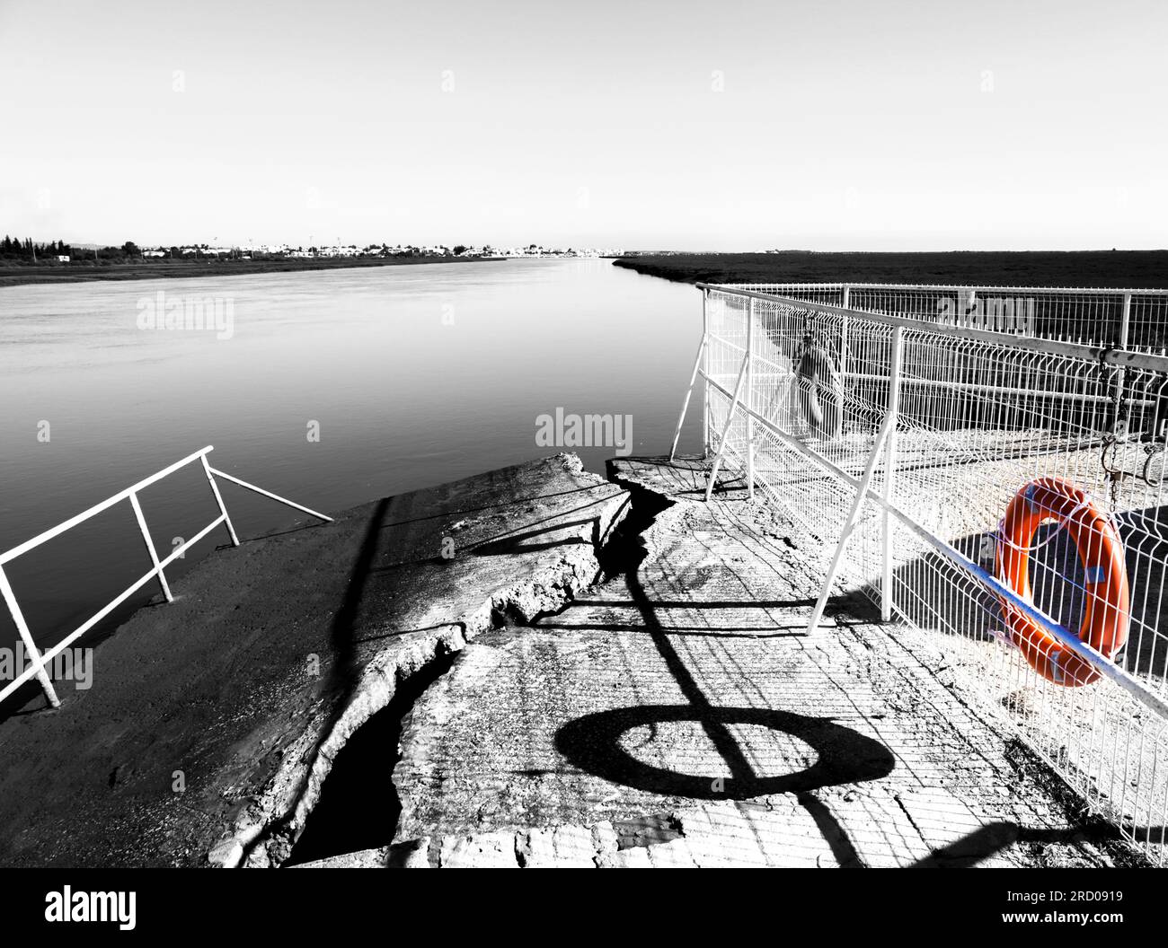 Broken pier of Ilha de Tavira bridge over the Gilao River in Portugal ...