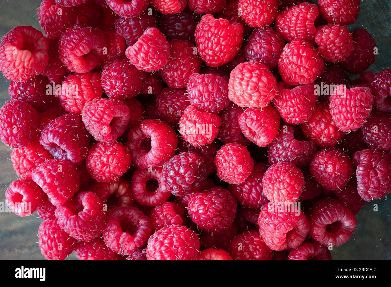 Pile of red raspberries Stock Photo - Alamy