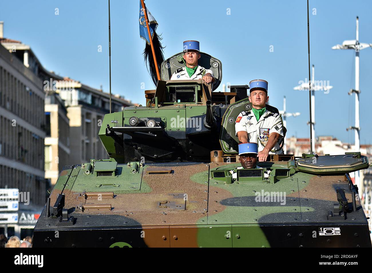 Soldiers on an armored military vehicle equipped with a cannon parade ...