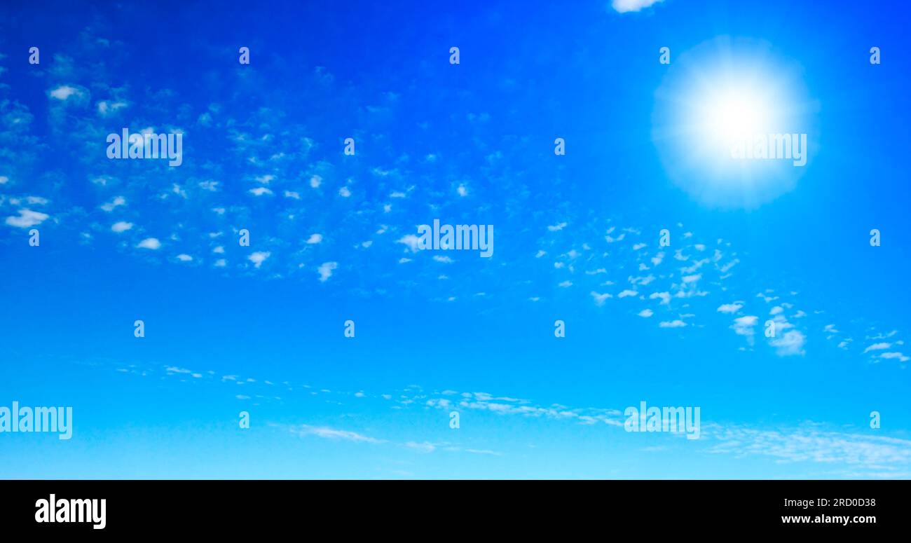 sun on beautiful blue sky Stock Photo - Alamy