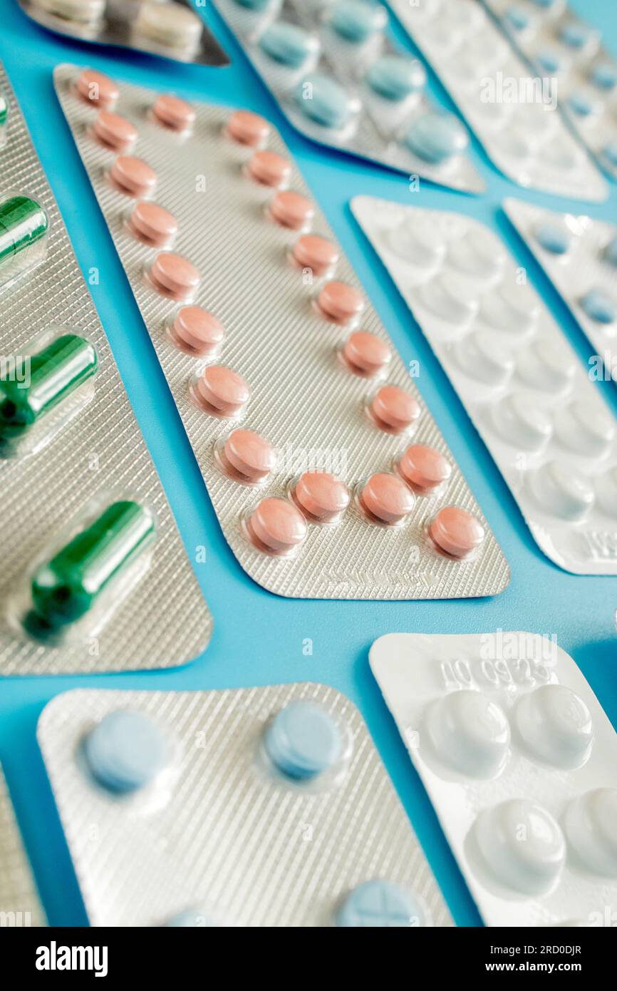 Colorful of tablets and capsules pill in blister packaging arranged ...