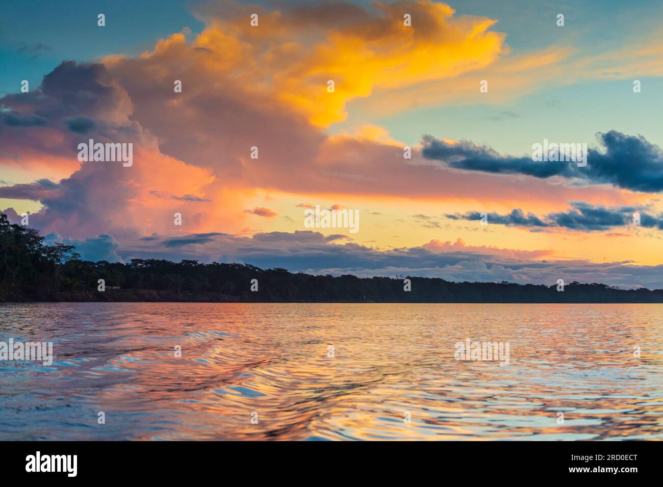Sunset lighting clouds over Madre de Dios River in Peru Stock Photo - Alamy