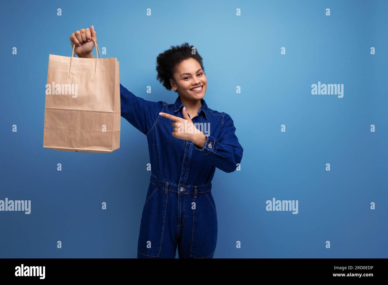 happy positive activist young hispanic brunette woman with fluffy curly ...