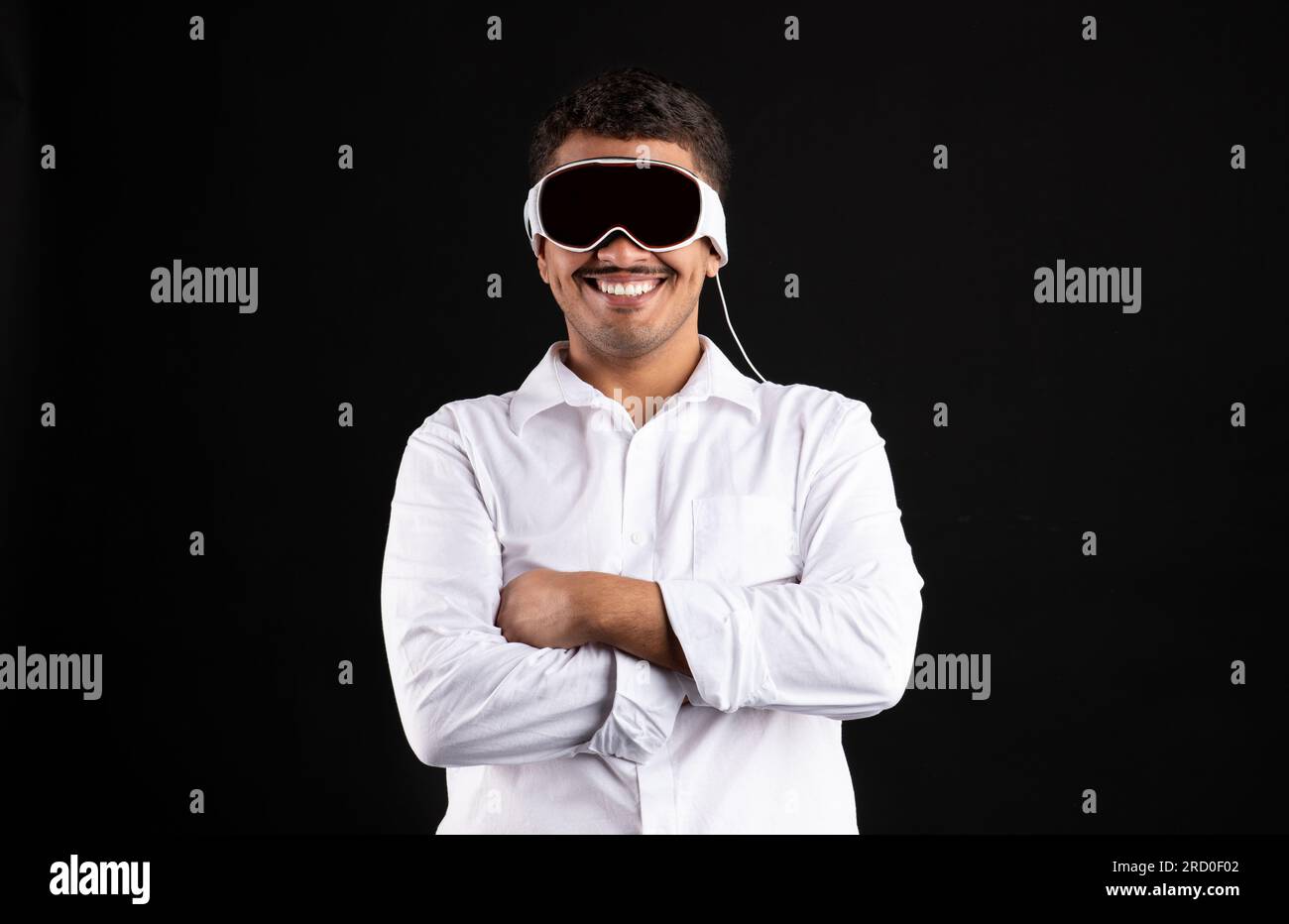 Excited brazilian man wearing vision pro vr glasses, standing with ...