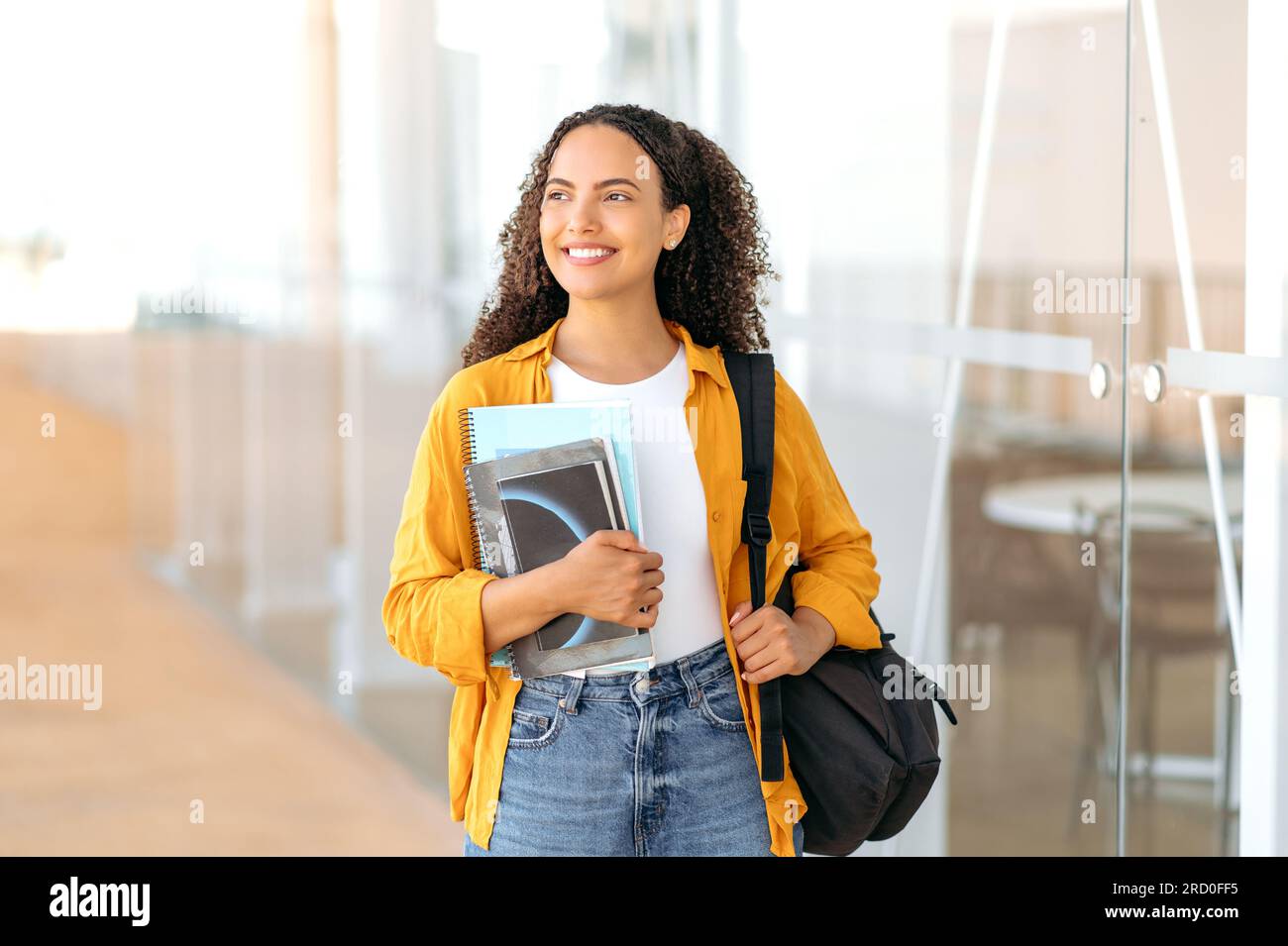Woman university student. Happy lovely brazilian or hispanic female ...