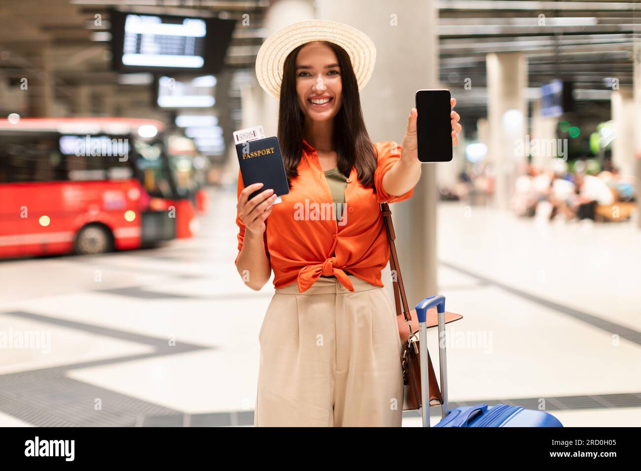 Passenger Lady Showing Phone Screen And Tickets At Bus Station Stock ...