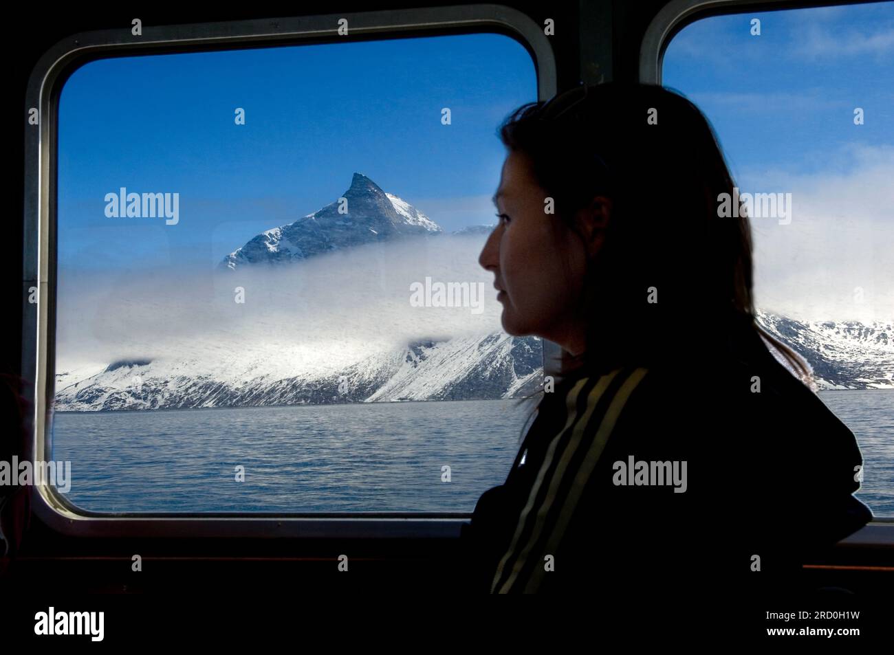 An Inuit woman looks out the window from Boat tour of sea ways near ...