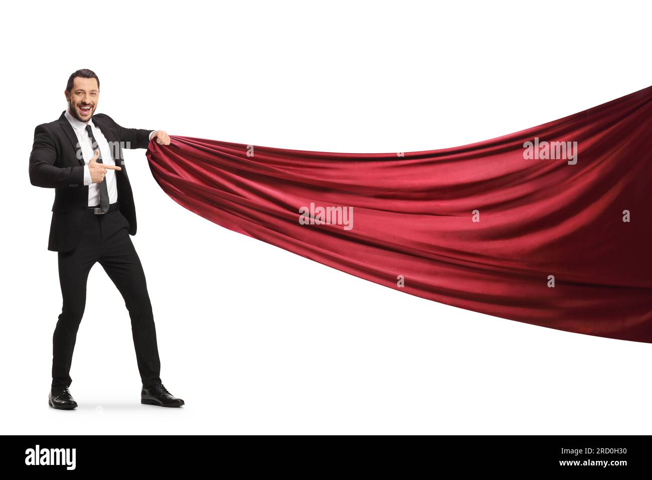 Businessman pulling a red piece of cloth and pointing isolated on white ...