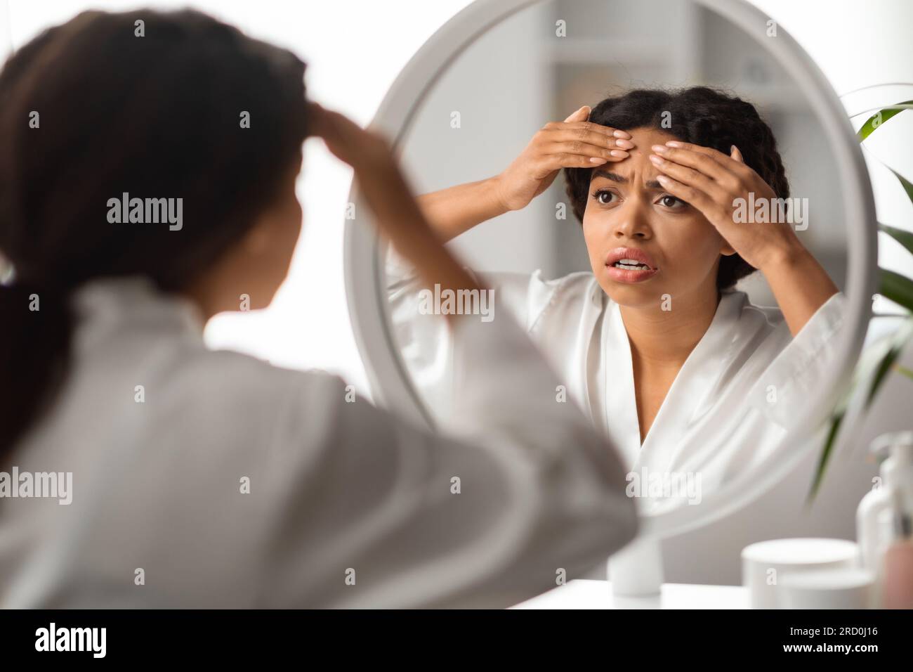 Stressed Black Lady With Pimple On Forehead Looking In Mirror At Home ...